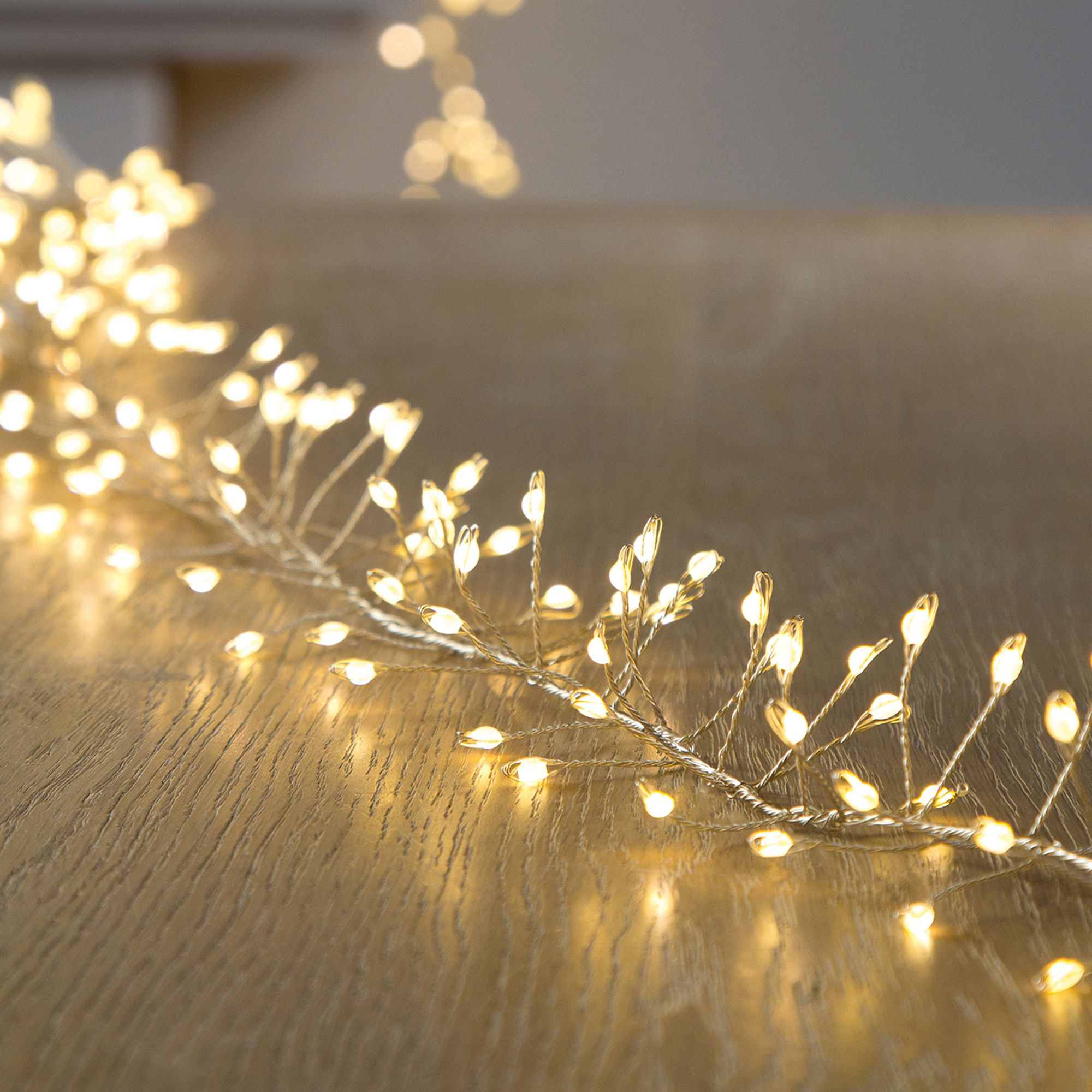 1200 Warm white LED Cluster string light with Silver cable | DIY at B&Q