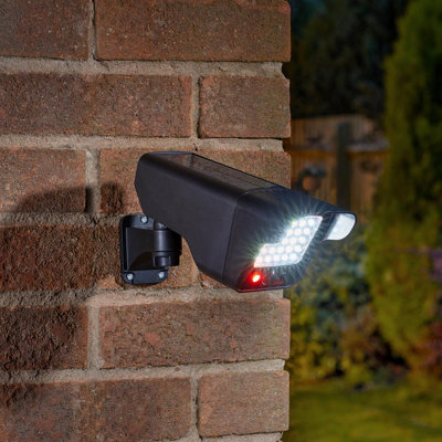 Black Solar Powered PIR Motion Sensor Floodlight & Decoy Camera - 280 Lumen Outdoor Wall or ...