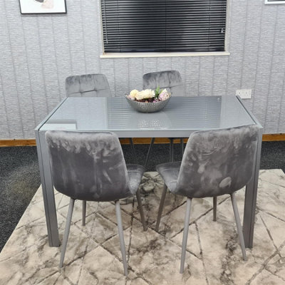Glass dining table with velvet chairs store
