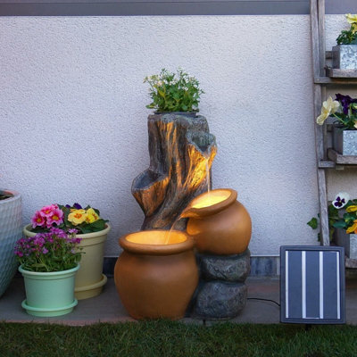 Festive Lights Solar & Plug-in Rustic Tree Trunk Terracotta Water ...