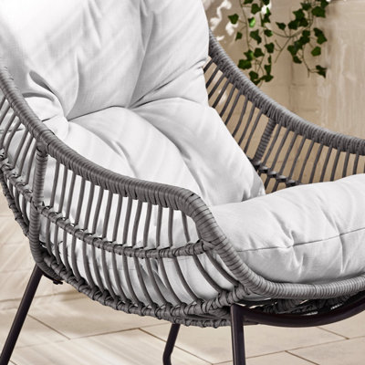 Rattan garden chair with footrest store