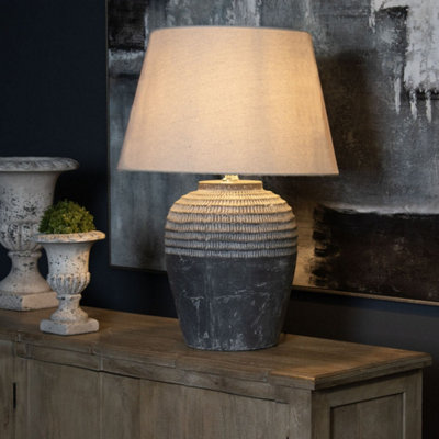Grey Stone Base Table Lamp with Tribal Carved Pattern and Linen Shade