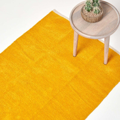 Homescapes Mustard 100% Cotton Plain Chenille Rug with Natural Trim, 90 ...