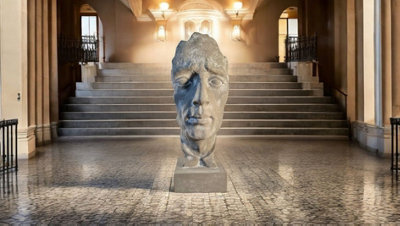 Large Grey Face Statue on Stan