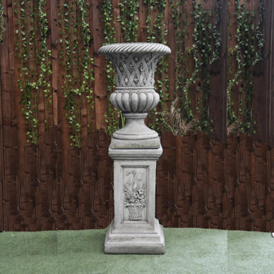 Large Stone Cast Garden Vase and Plinth with Flower Design at B&Q