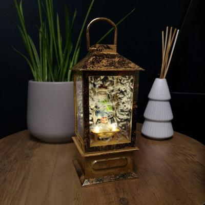 Lit Gold Musical Snowing Lantern 19cm | DIY at B&Q