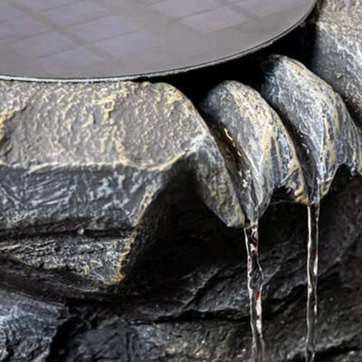 Primrose Dornie Solar Powered Grey Stone Effect Outdoor Pouring Water ...