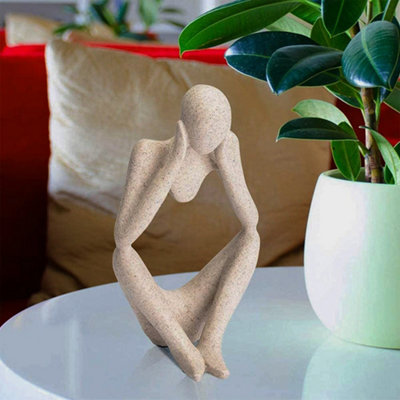 thinking figure statue