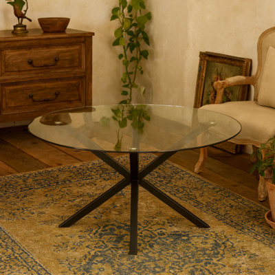 Saignon 1200mm Round Glass Dining Table with Black Cross-Leg Metal Base