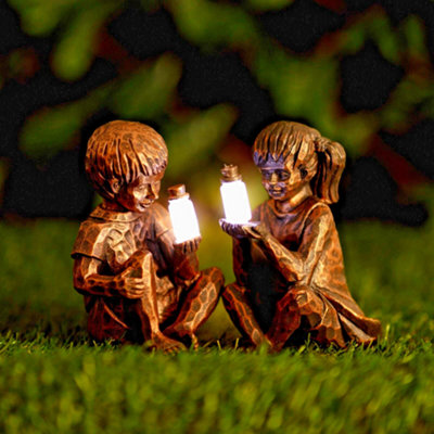 Solar Powered Boy and Girl with Fireflies Statue Resin Home Garden Ornament