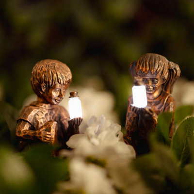 Solar Powered Boy and Girl with Fireflies Statue Resin Home Garden Ornament