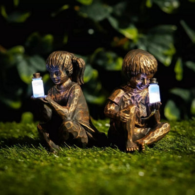 Solar Powered Boy and Girl with Fireflies Statue Resin Home Garden Ornament
