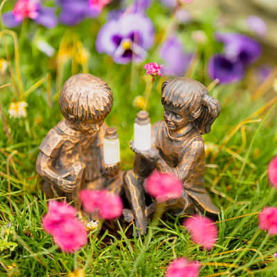 Solar Powered Boy and Girl with Fireflies Statue Resin Home Garden Ornament