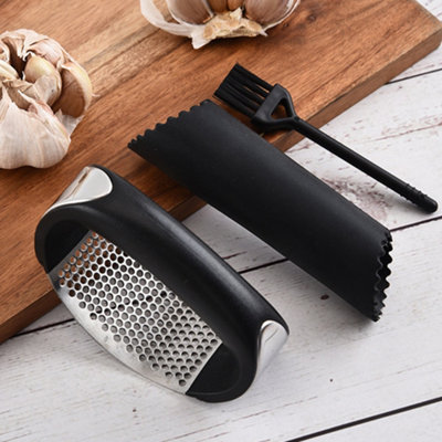 Stainless Steel Garlic Press Rocker with Peeler and Brush | DIY at B&Q